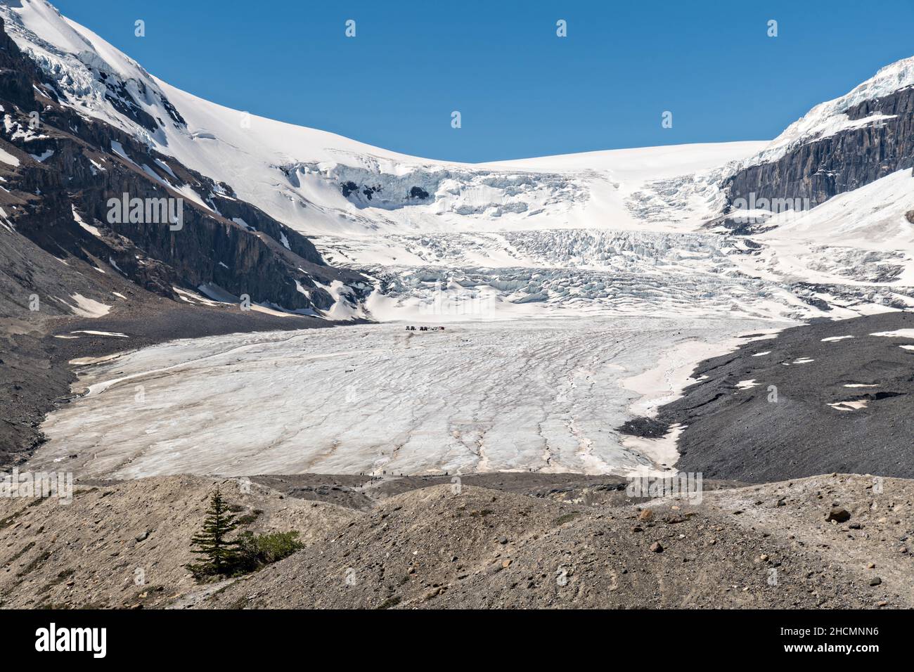 Tourists on Ice Explorer transporter appear tiny on the massive the ...