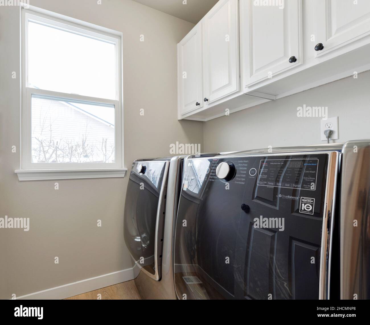 Modern residential laundry room interior Stock Photo - Alamy