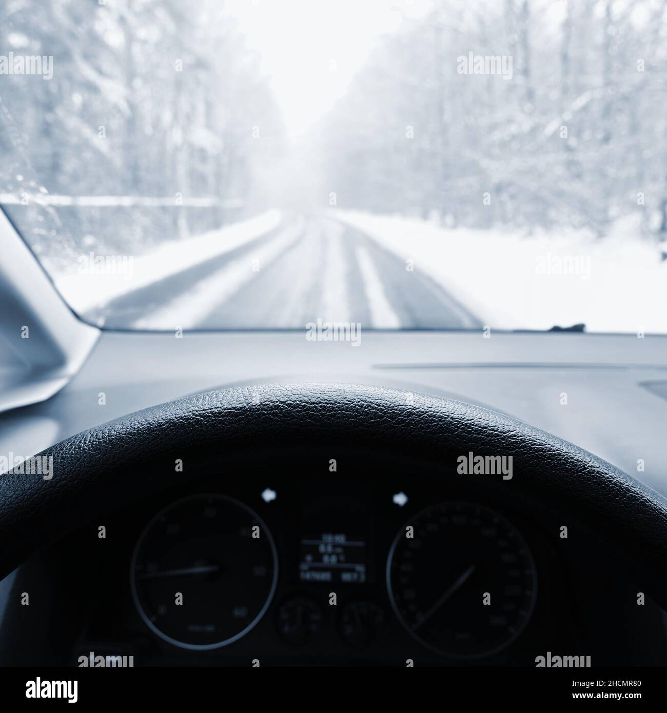 Driving the car in the winter. View from the interior of a car on a ...