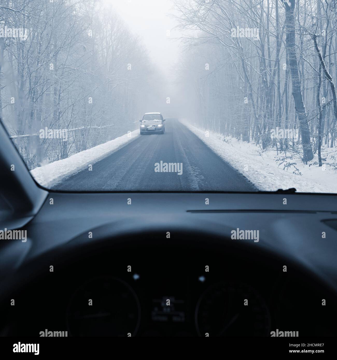 Driving the car in the winter. View from the interior of a car on a ...