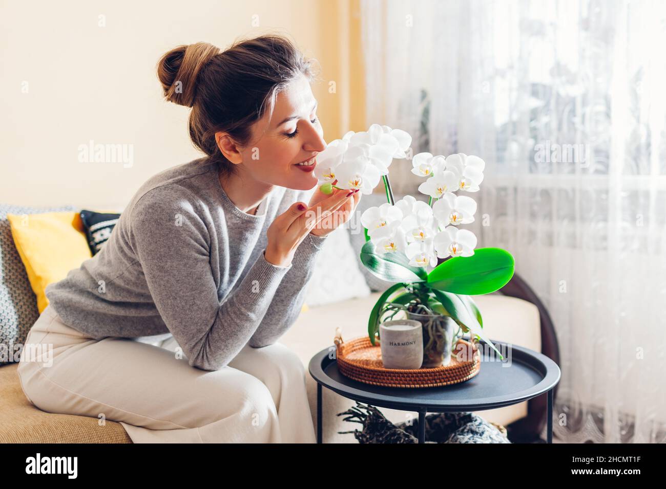 Woman smelling plants indoor hi-res stock photography and images - Alamy