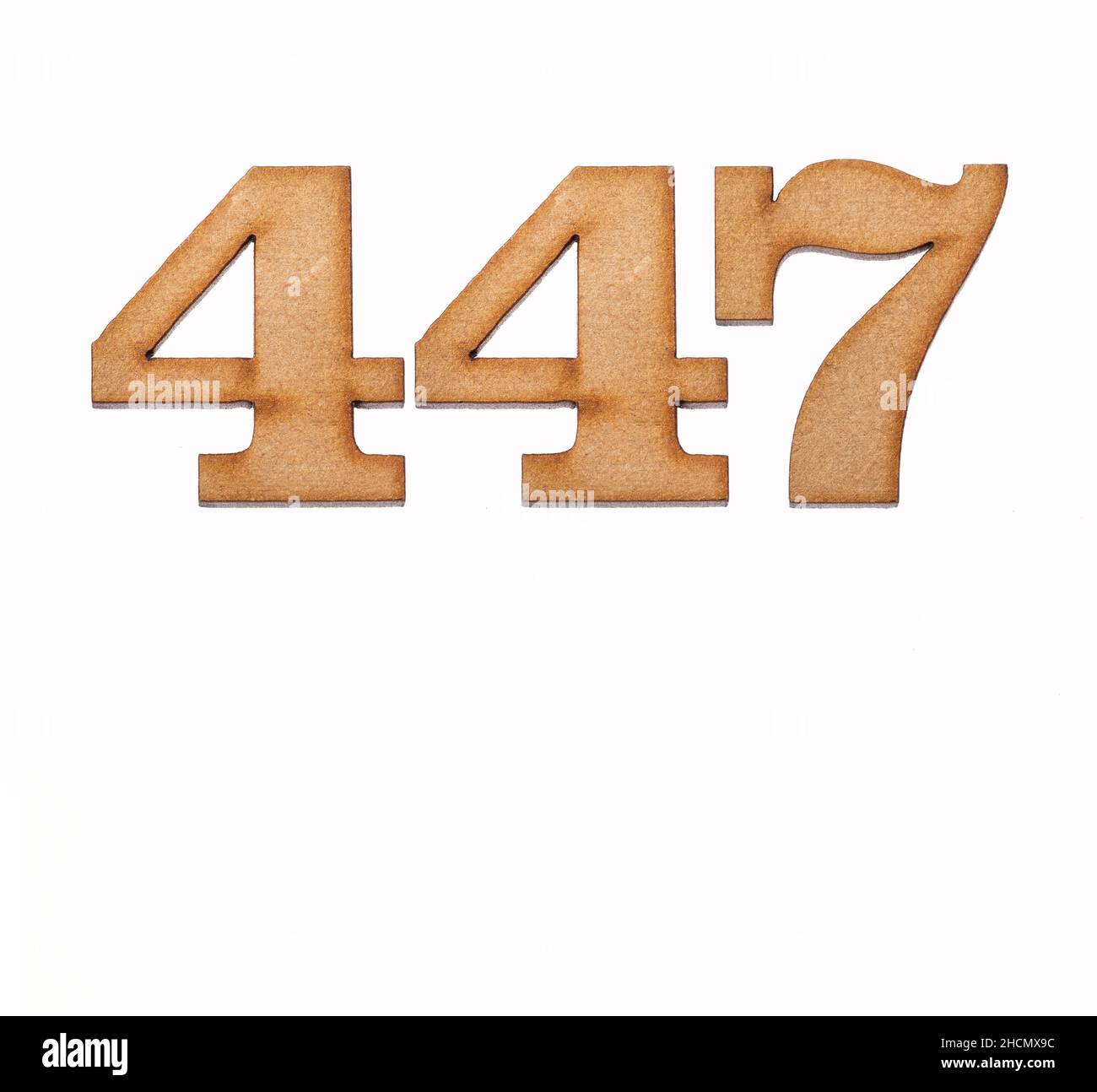 Number 447 - Piece of wood isolated on white background Stock Photo - Alamy