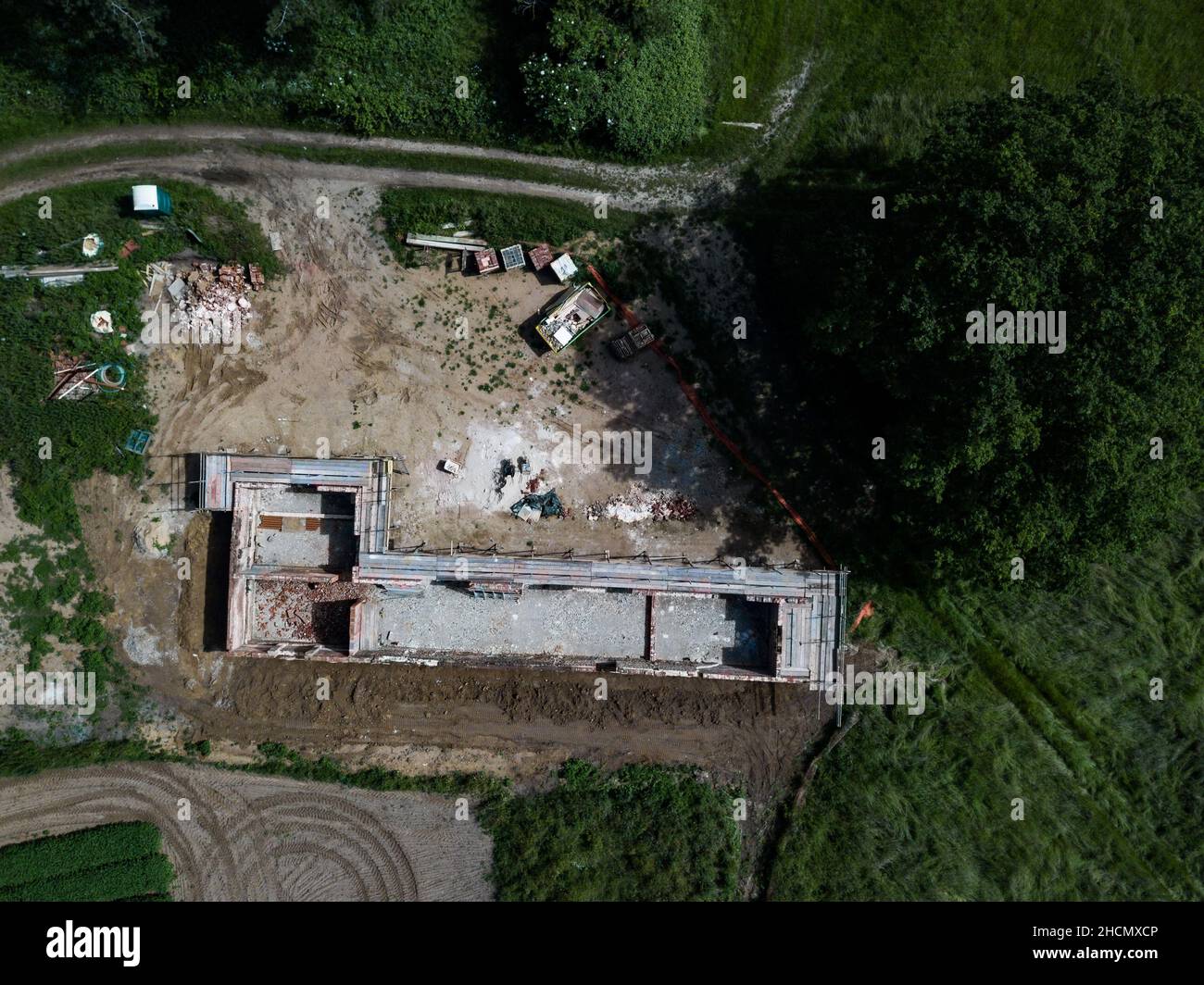 Aerial view of a partly converted barn or farm building showing ...