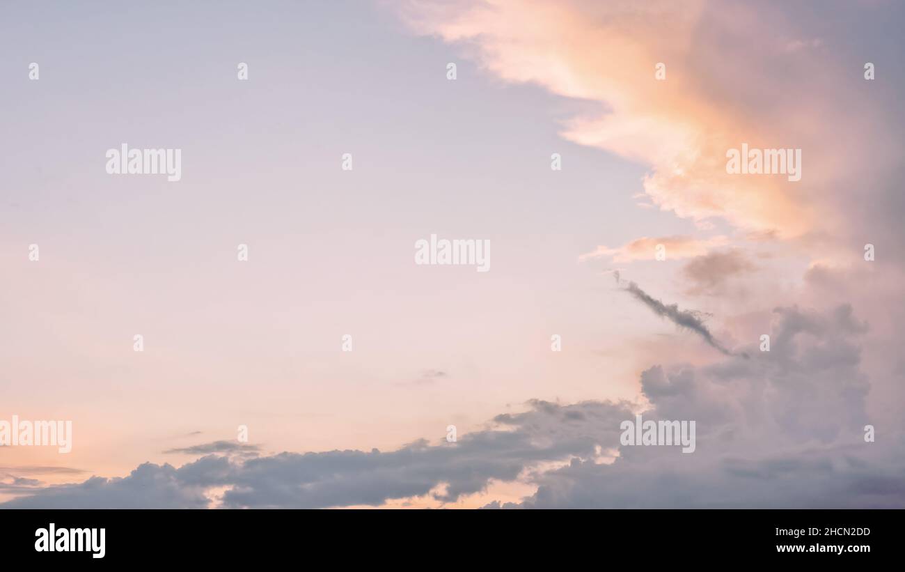 Dramatic cloudy pastel colored sunset sky. Natural background with copy ...