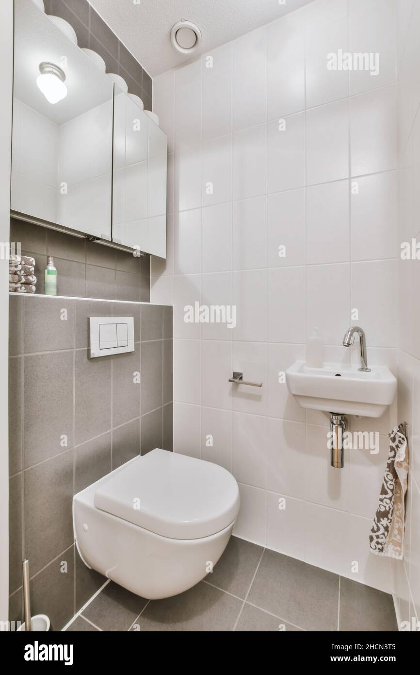 Interior of small clean restroom in miniature style Stock Photo - Alamy