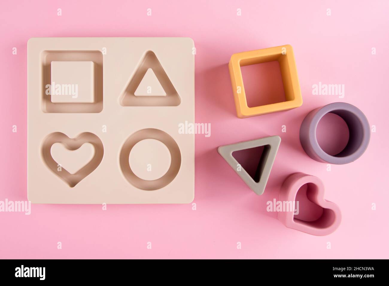 Baby soft nesting sorting ans stacking toy for arranging by color and geometric shape. Silicone ...