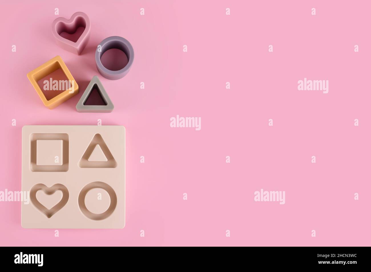 Baby soft nesting sorting ans stacking toy for arranging by color and geometric shape. Silicone ...