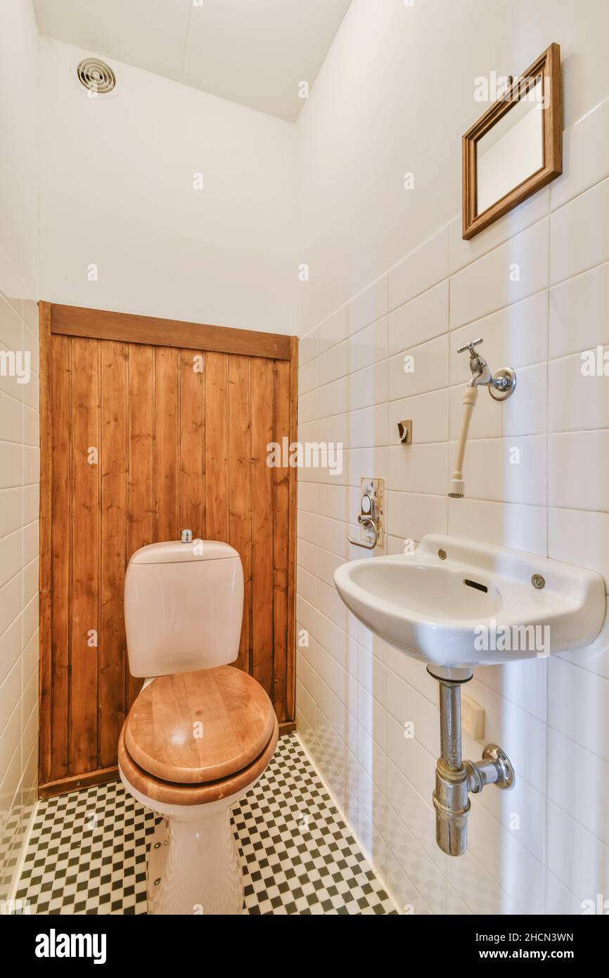 Interior of small clean restroom in miniature style Stock Photo - Alamy