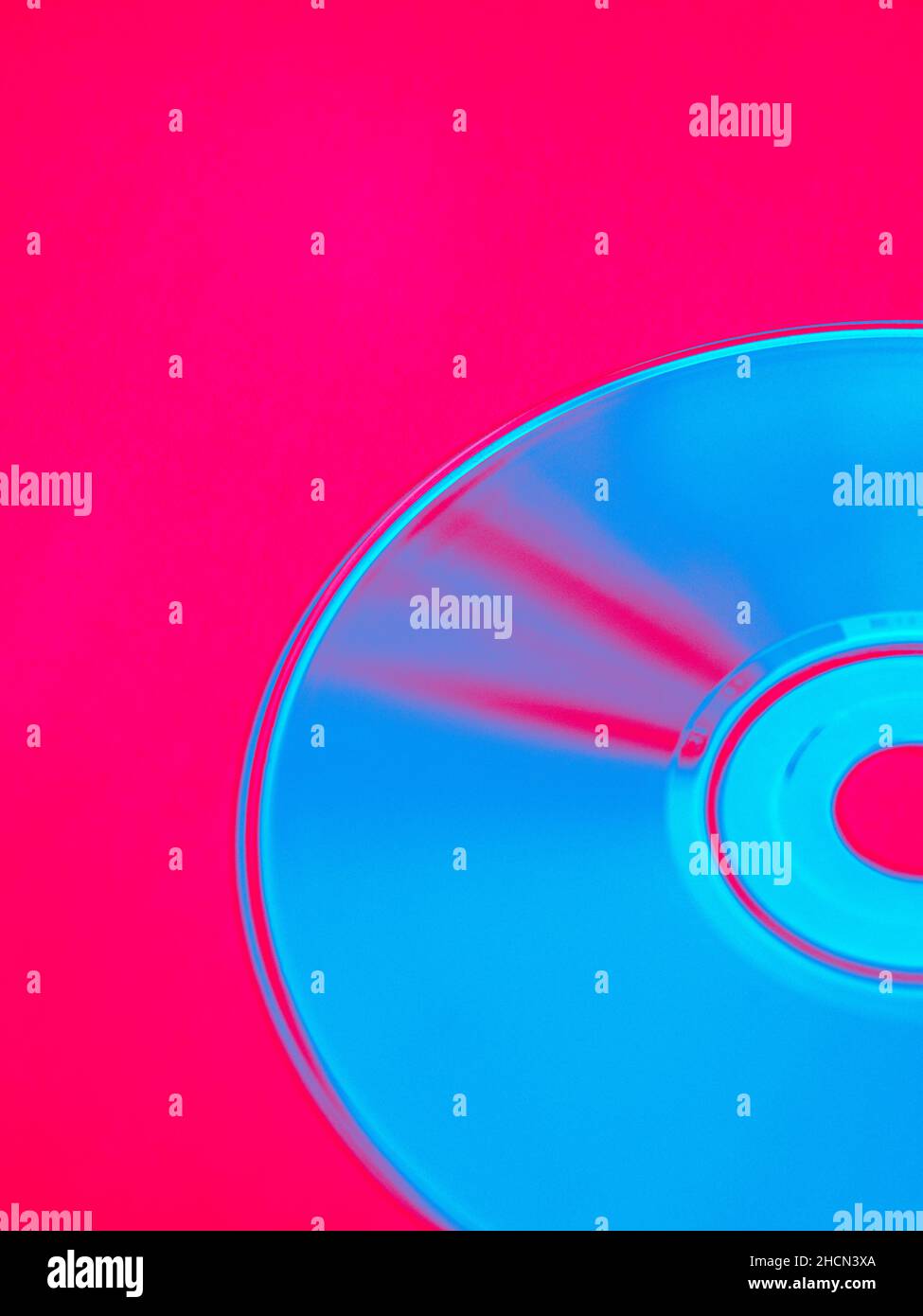Graphical image of blue CD against red background Stock Photo - Alamy