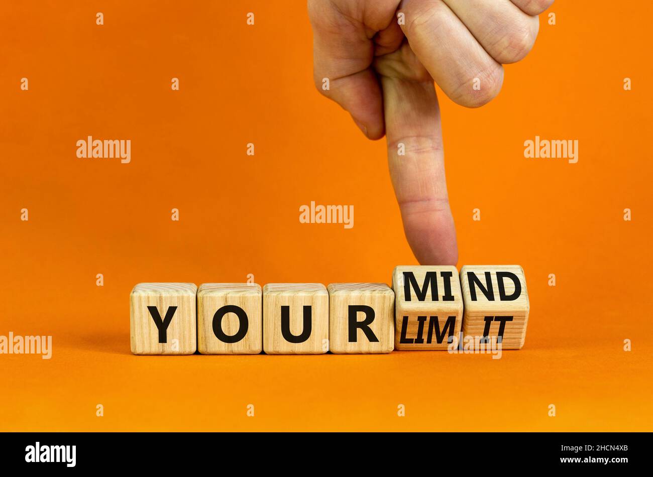 Your mind is limit symbol. Businessman turns cubes and changes words ...