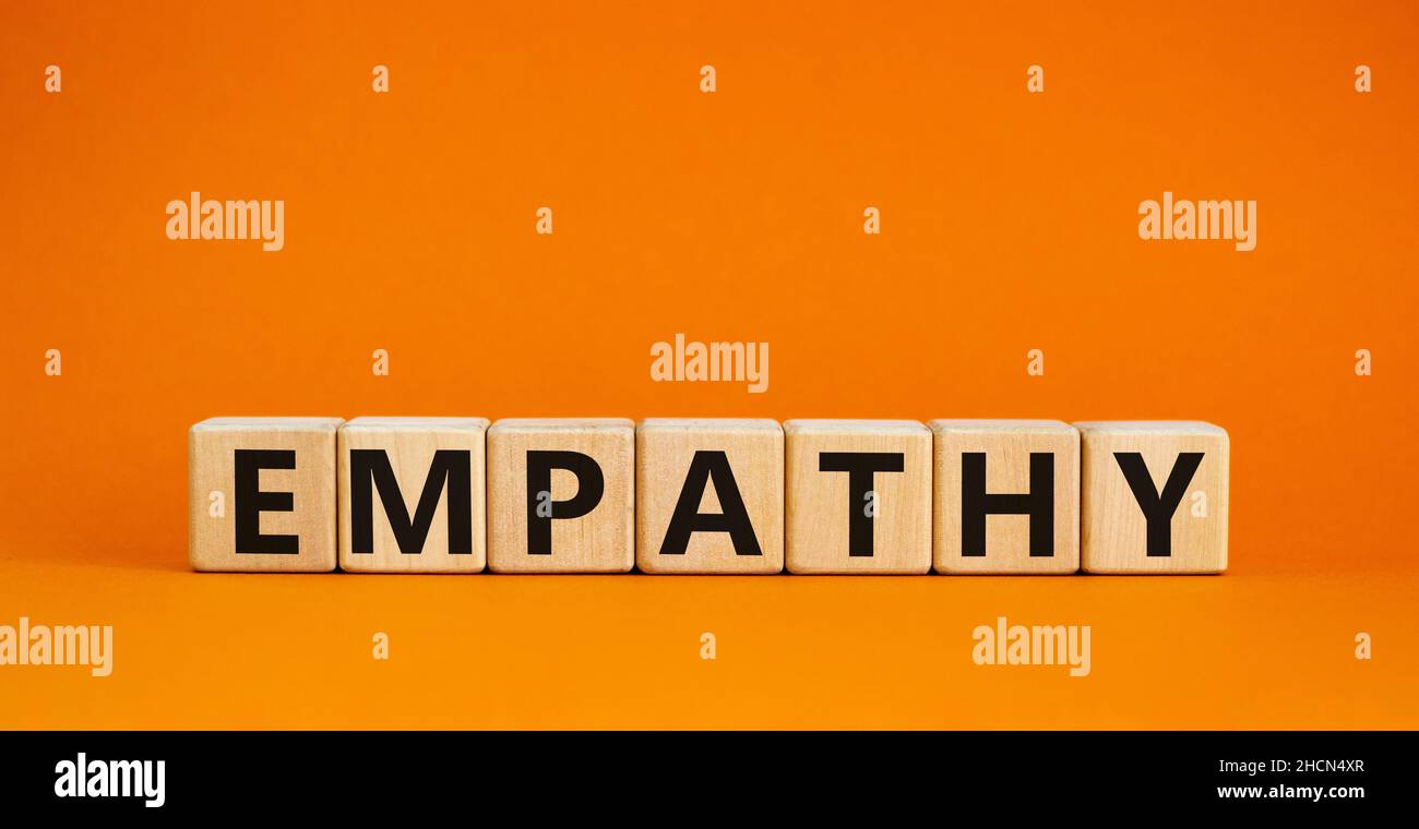 Empathy symbol. The concept word Empathy on wooden cubes. Beautiful ...