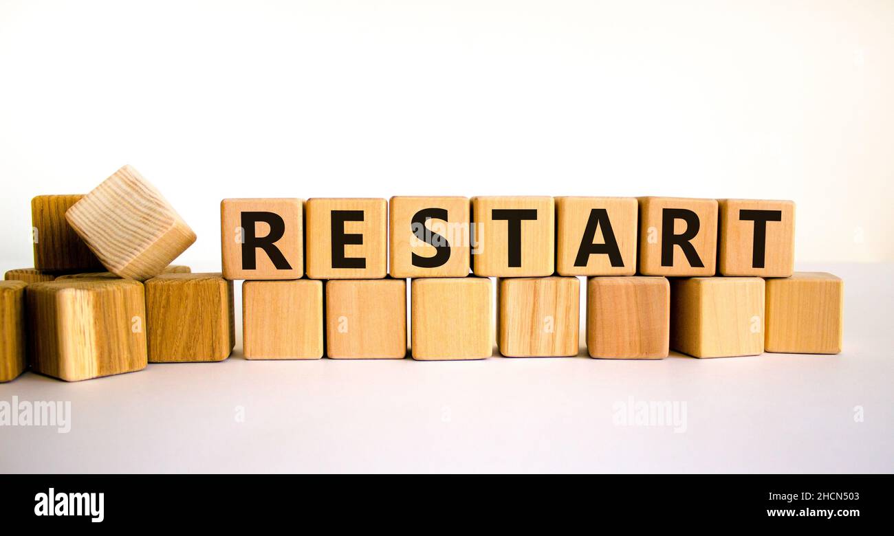 Restart and start symbol. The concept word Restart on wooden cubes ...