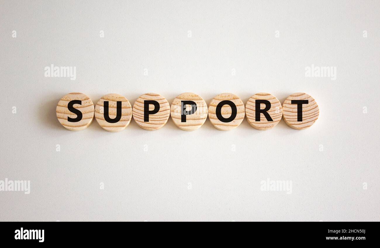 Support symbol. The concept word Support on wooden circles. Beautiful ...