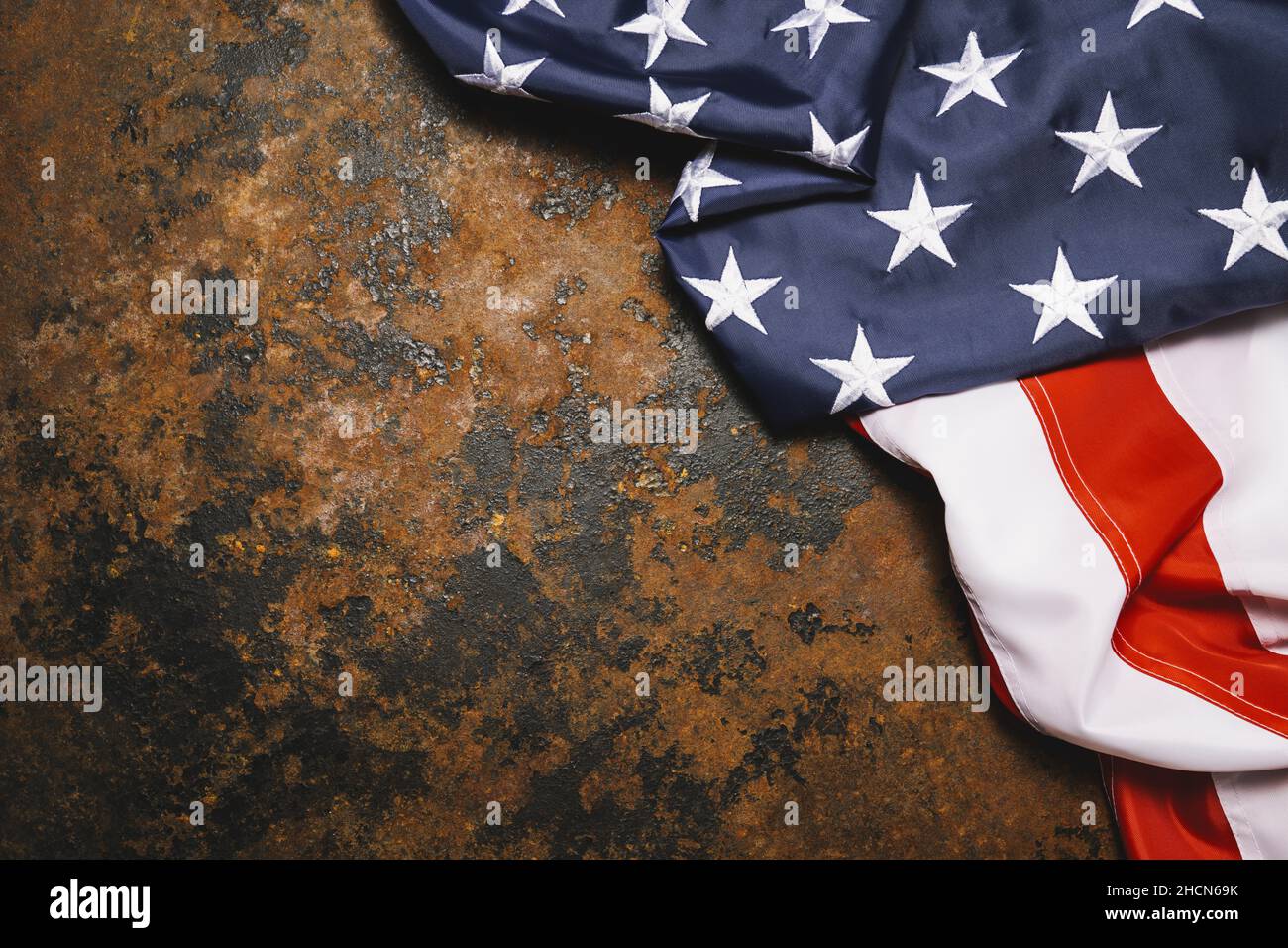 American flag on dark rusty metal with free space. 4th July Veterans or ...