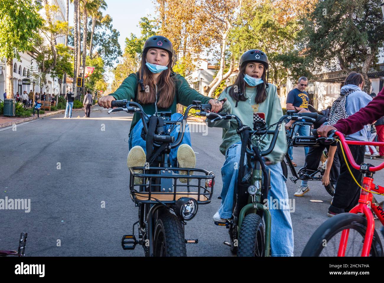 Two teens on electric bikes teenage girls with electric bikes and ...