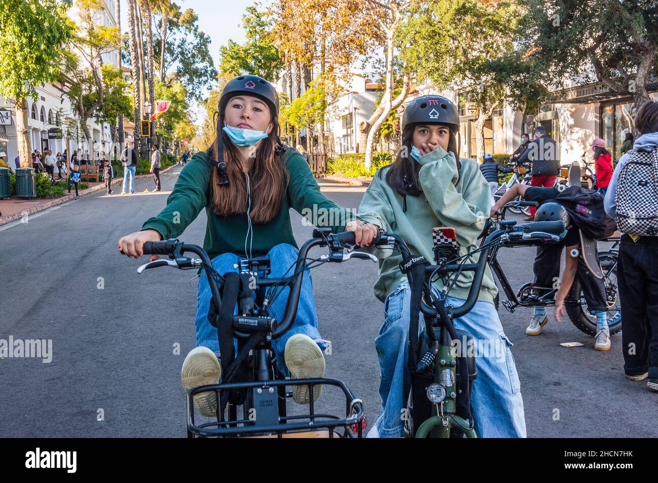 Two teens on electric bikes teenage girls with electric bikes and ...