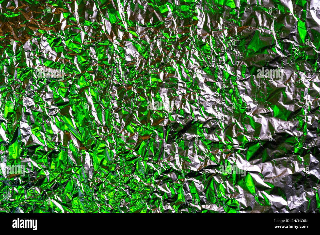 crumpled foil background illuminated with colored lights Stock Photo ...