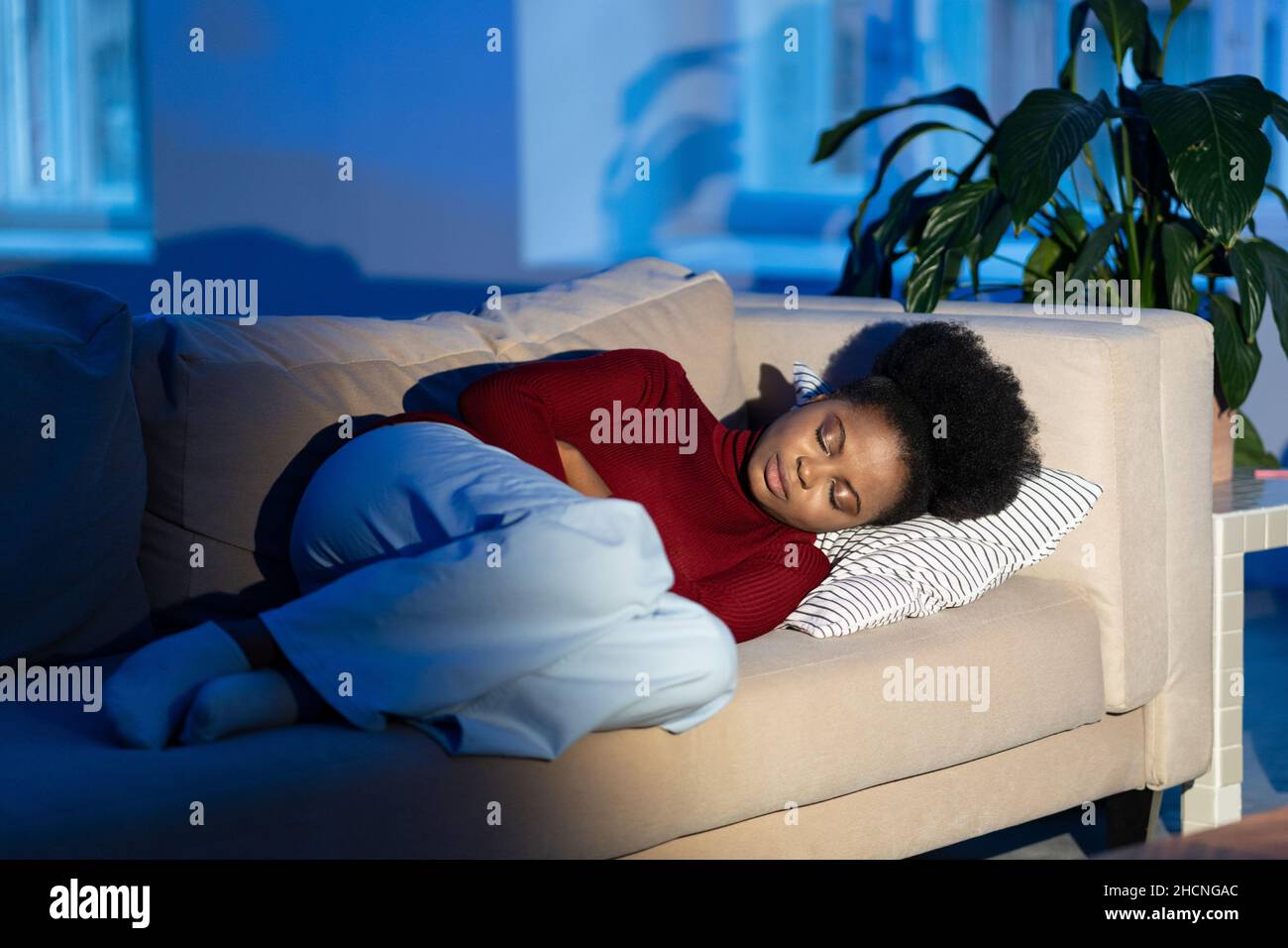 Exhausted african woman resting on sofa at home, anxious black female ...