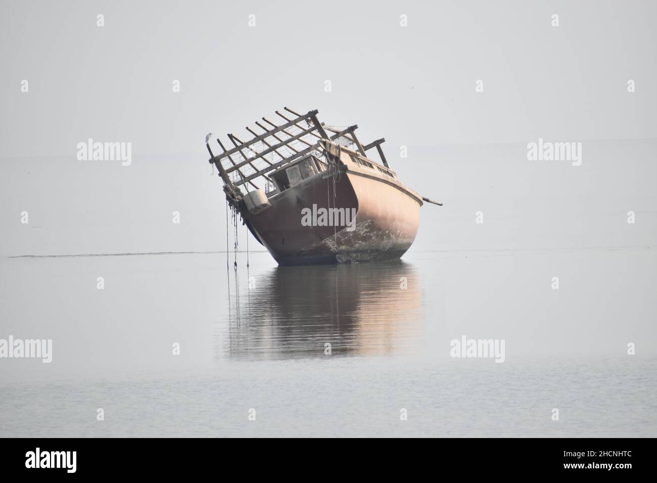 Old damaged wrecked ship in the sea Stock Photo - Alamy