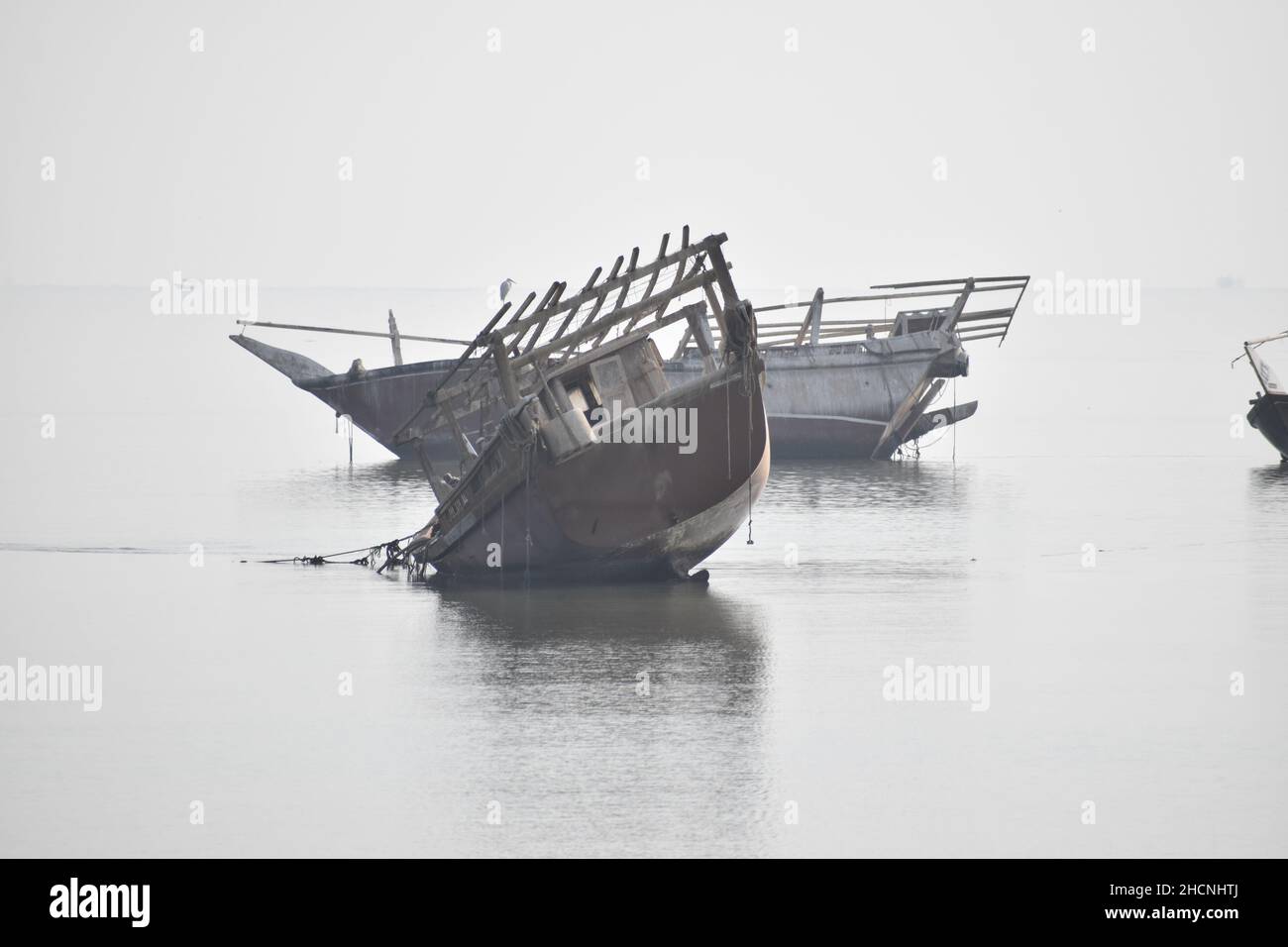 Old damaged wrecked ships in the sea Stock Photo - Alamy