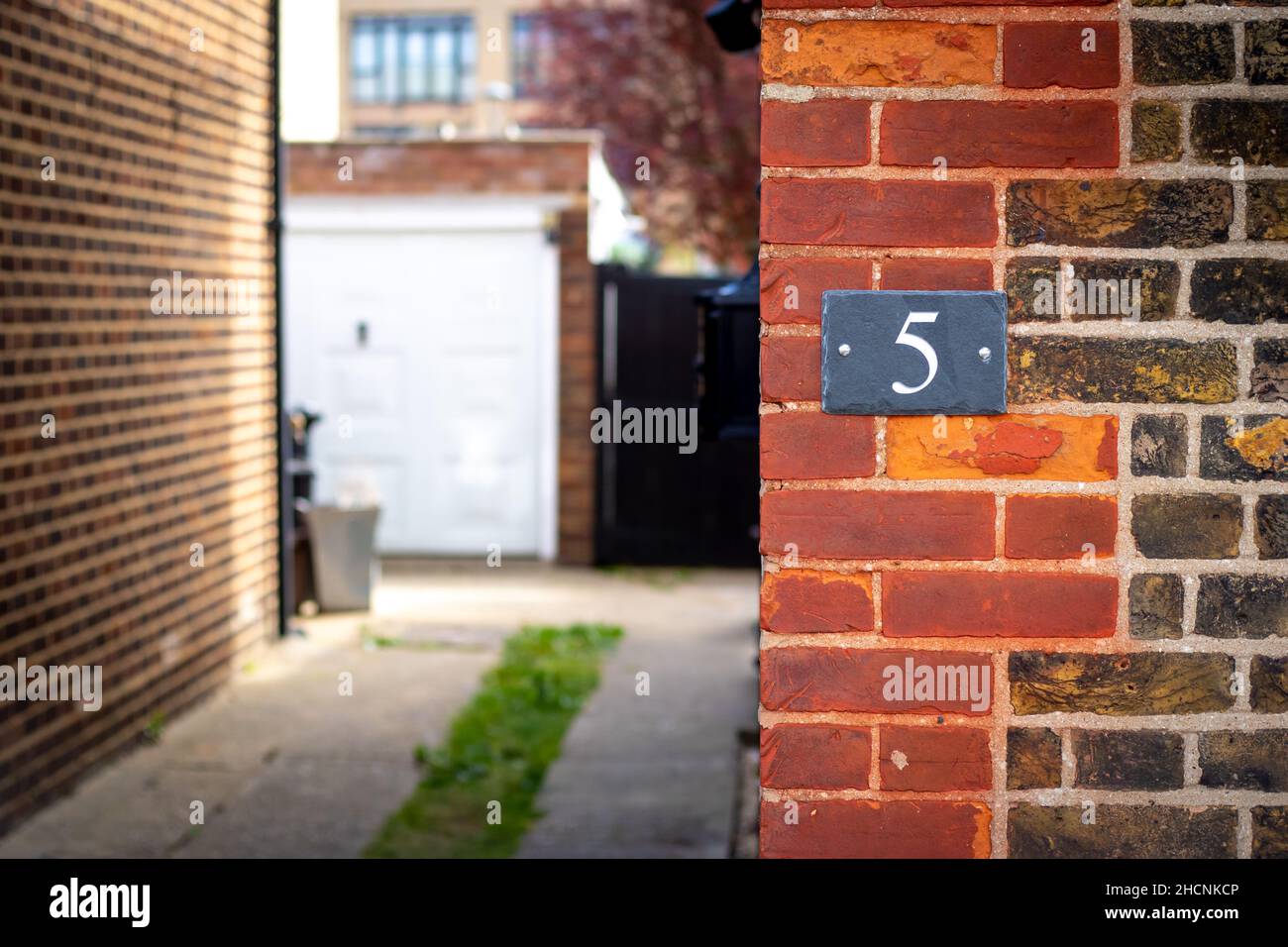 House number 5 on a brick wall Stock Photo - Alamy