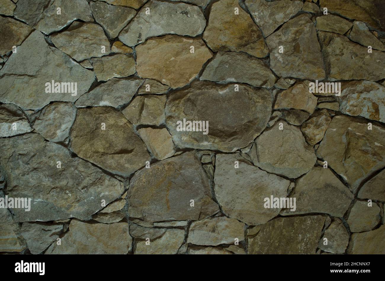 stone wall background and texture, stone blocks together. forming a ...