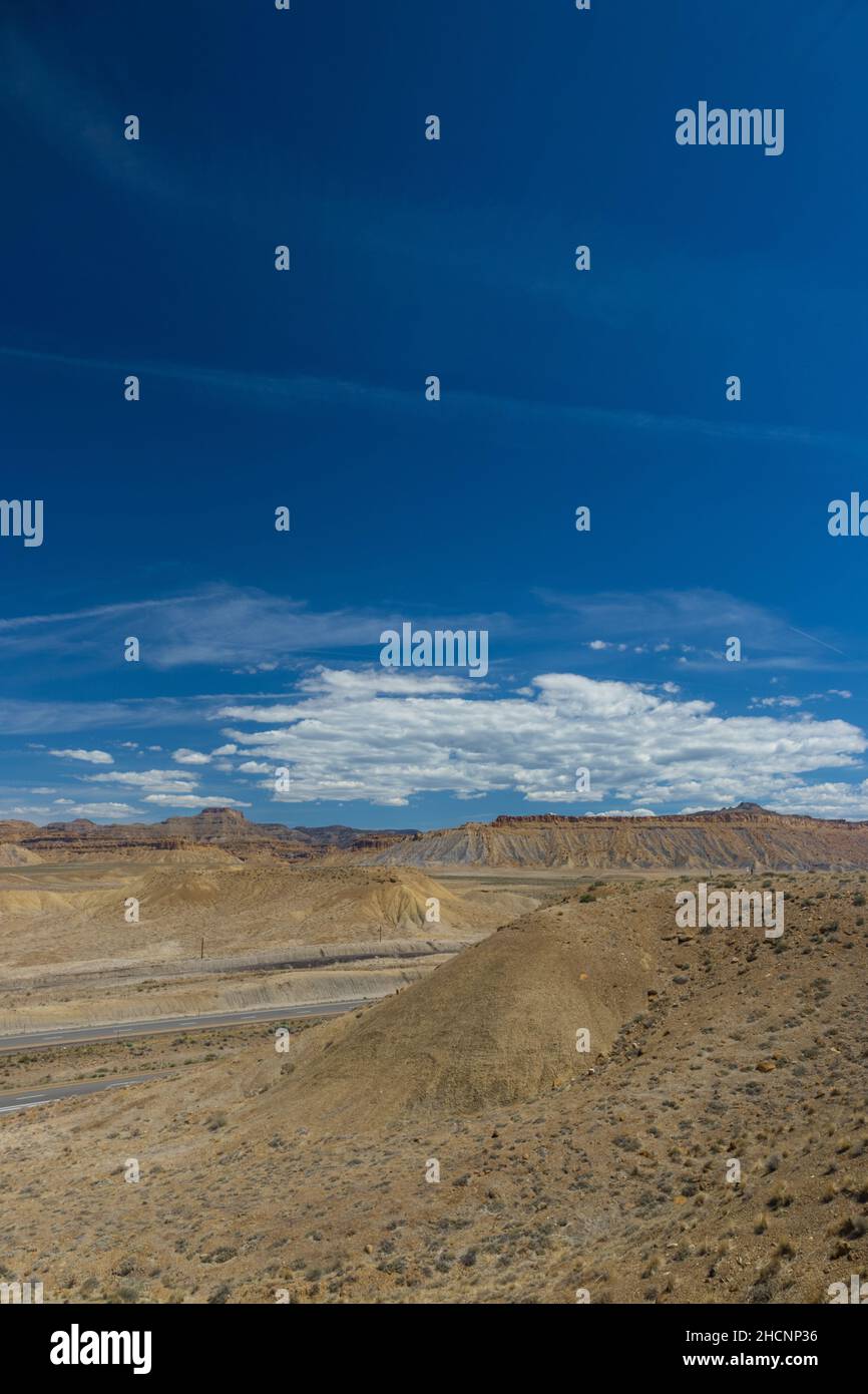 Beautiful view of a desert landscape with hills under a cloudy sky ...