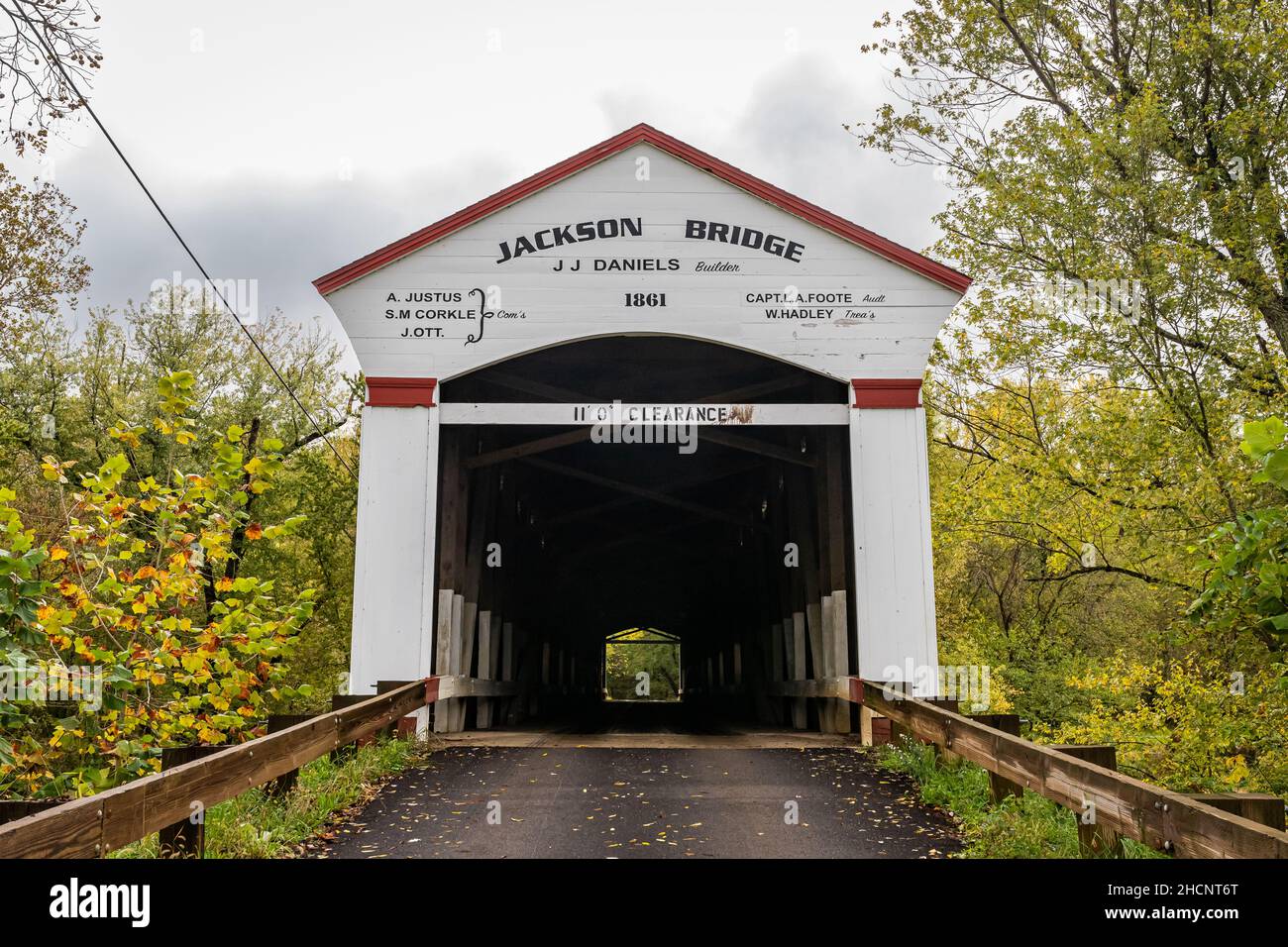 The Jackson Covered Bridge crosses Sugar Creek during Autumn leaf color ...