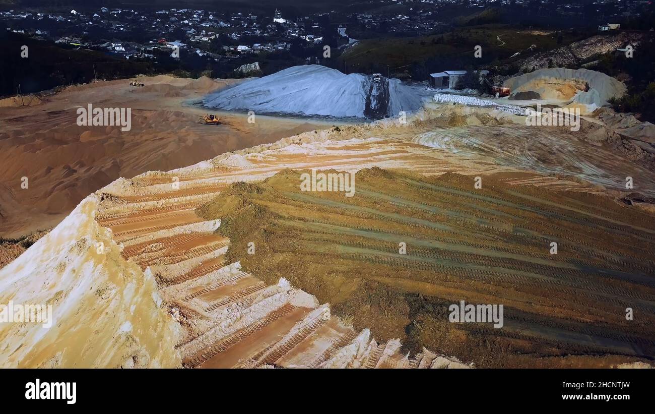Aerial view of the quarry and movement of mining trucks, heavy industry ...