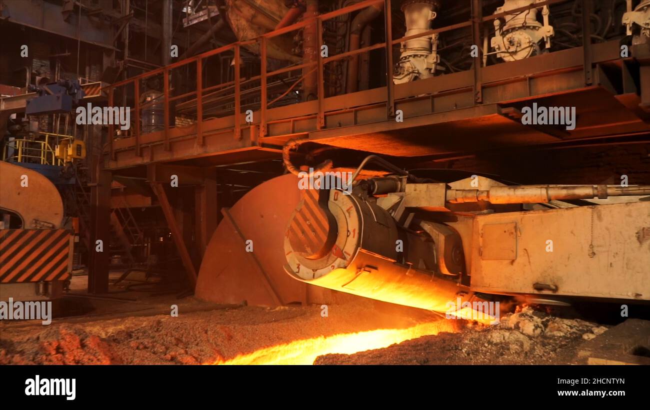 Hot metal production at the factory, metallurgy concept. Molten steel ...