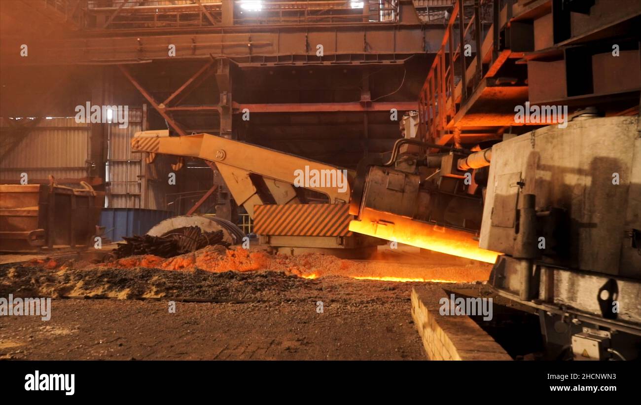 Hot metal production at the factory, metallurgy concept. Molten steel ...