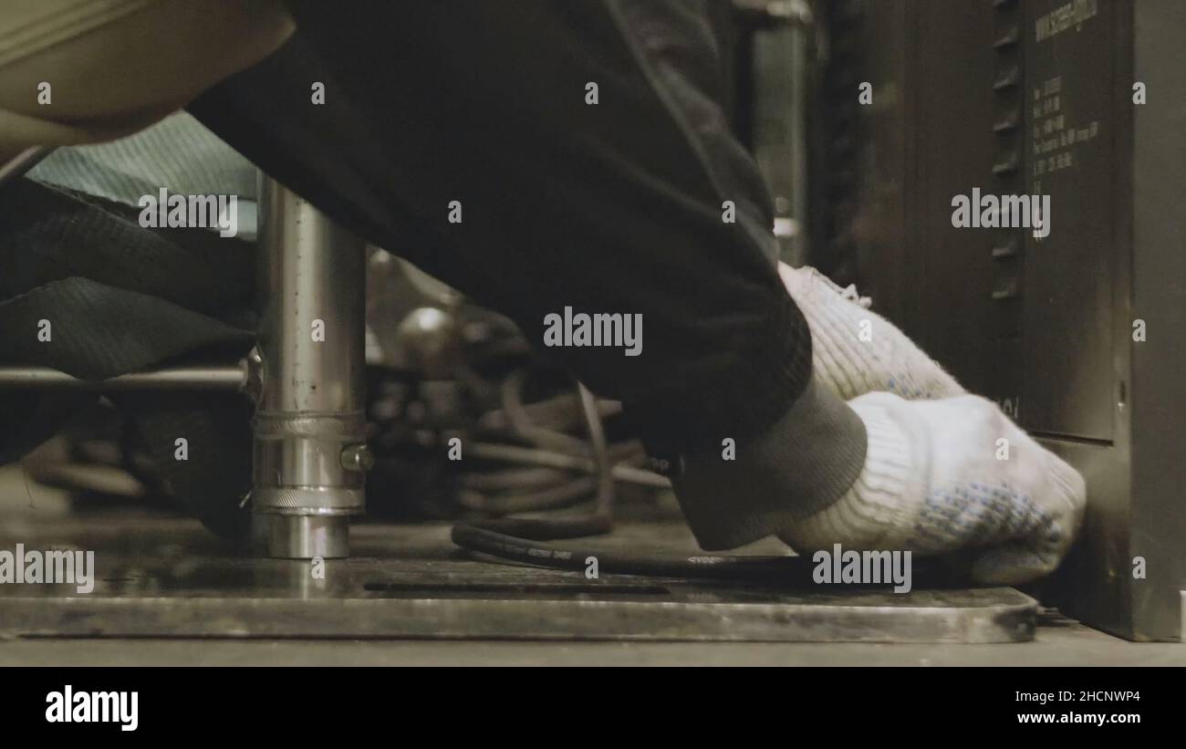 Electrician engineer tests electrical installations and wires on relay ...