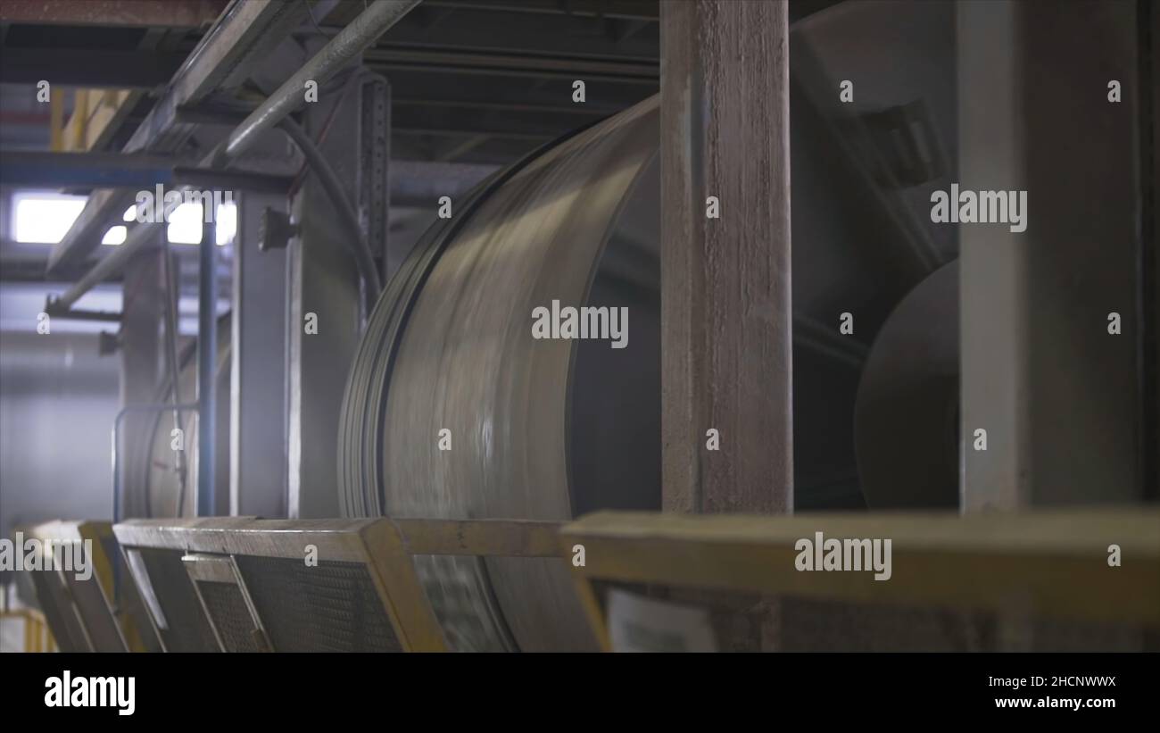 Ore dressing mill or factory grinder at the plant workshop. Rotating ...