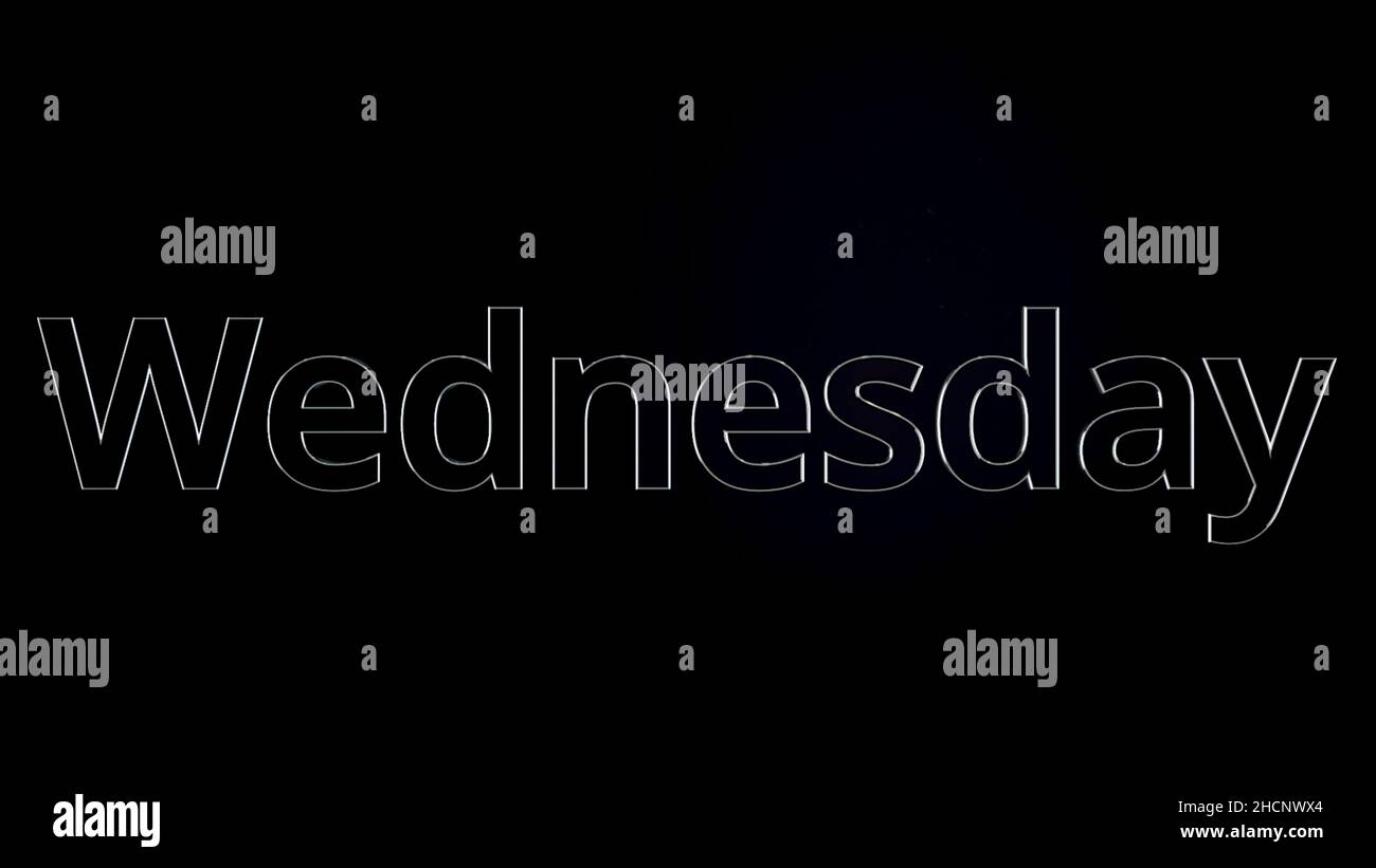Word wednesday animation on black background approaches and moves away ...