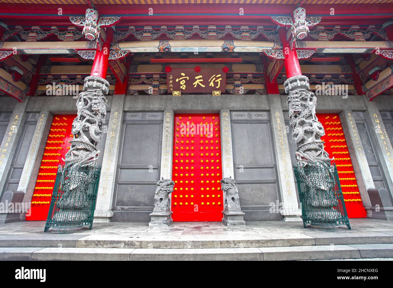 The huge red doors of the Xingtian Temple. The temple is a contemporary ...