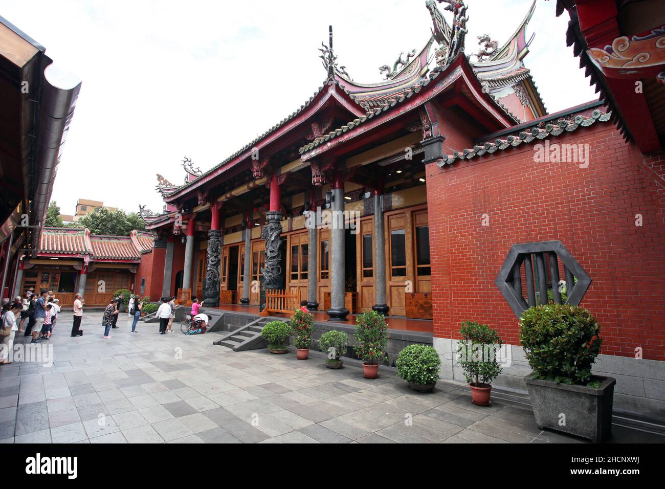 Inside the Xingtian Temple with visitors. The temple is a contemporary ...