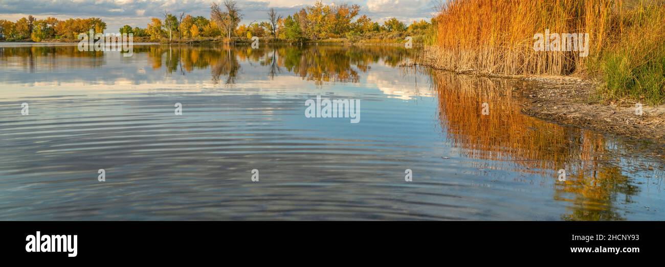 calm lake at sunset in one of Fort Collins natural areas in northern ...