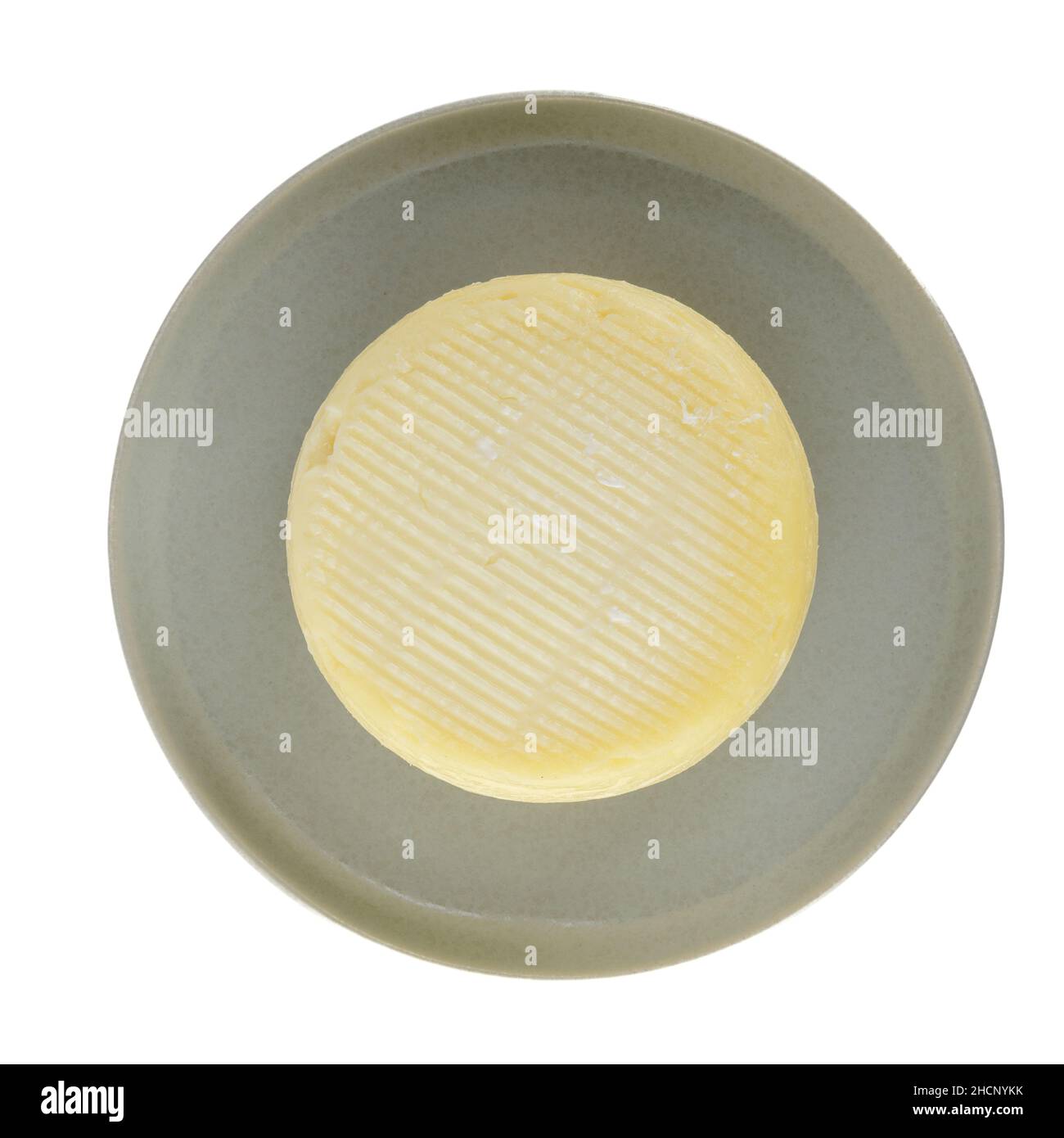 Round cheese on ceramic plate isolated on white background Stock Photo ...