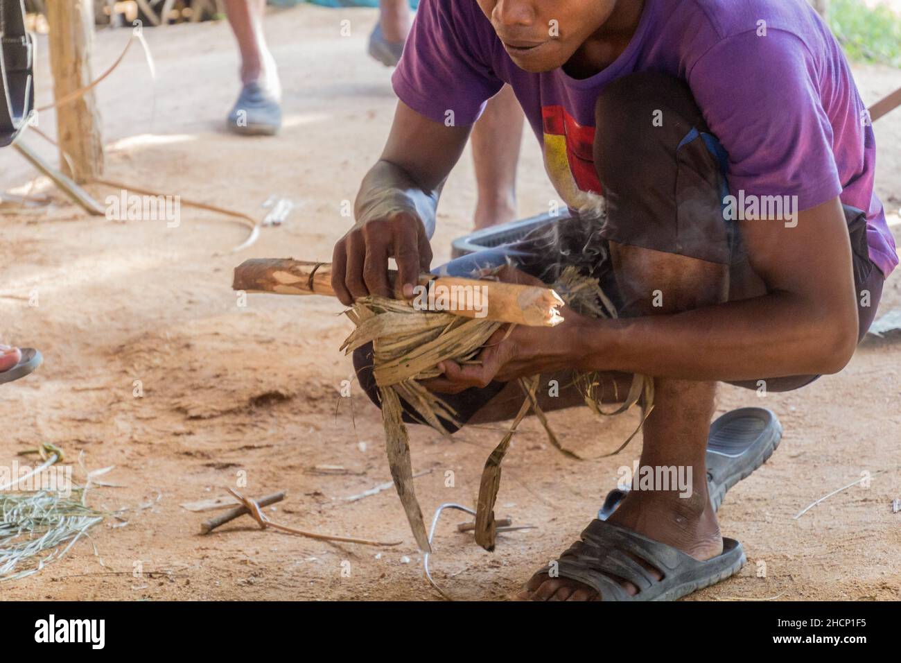 TAMAN NEGARA, MALAYSIA - MARCH 17, 2018: Indigenous man making fire in ...