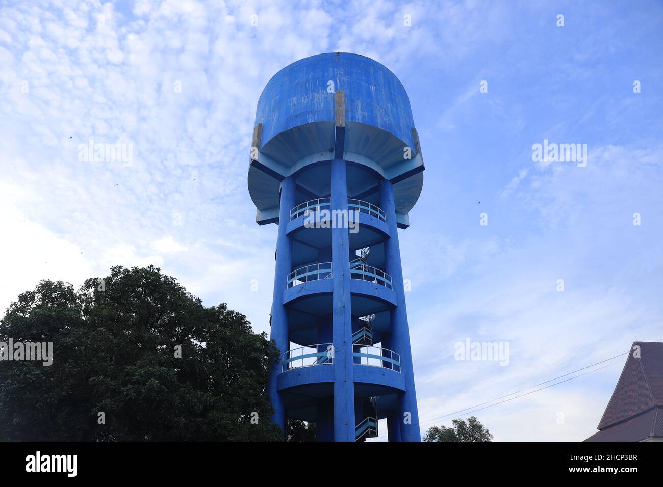 A giant water reservoir against a bright blue sky background Stock ...