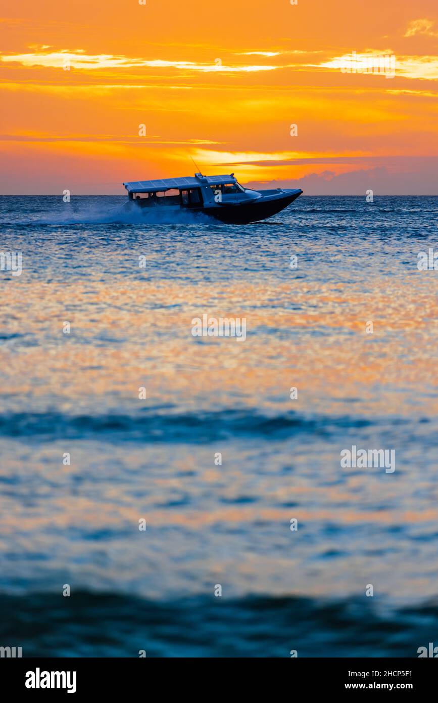 Golden skyline during sunset with sailboats in Boracay, Aklan ...