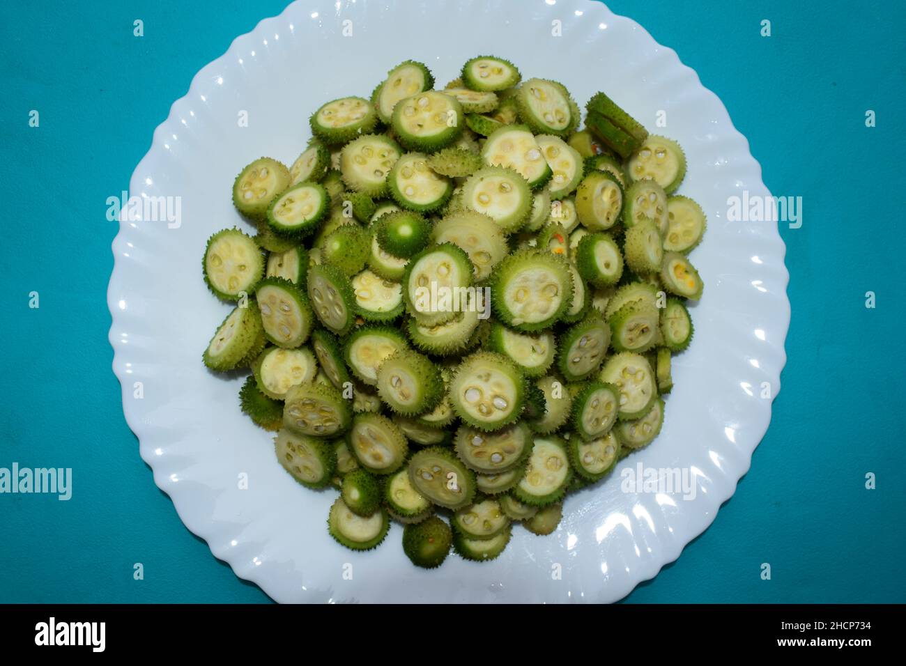 Chopped and cut in to thin slices Indian vegetable raw Spiny gourds ...