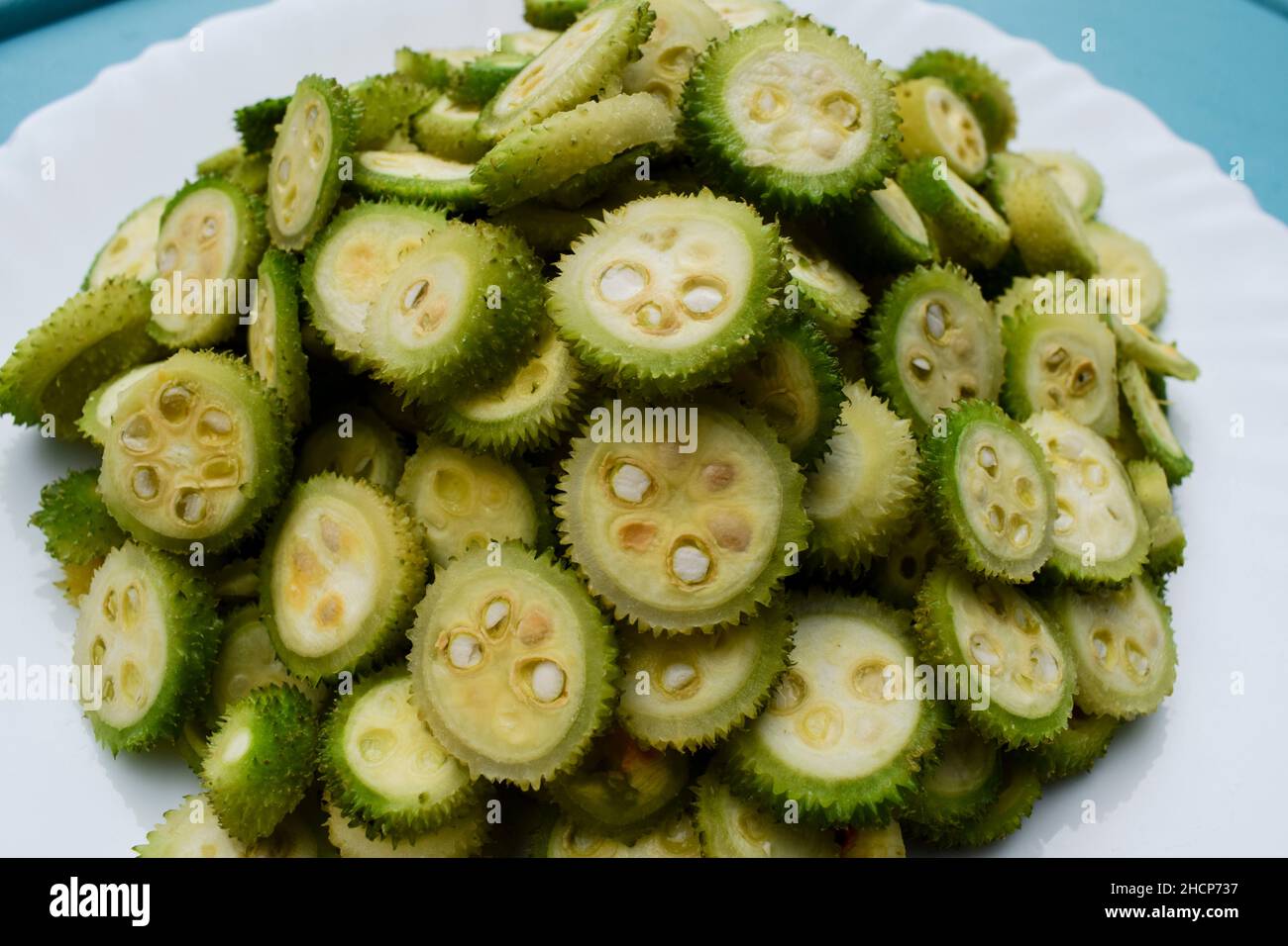Chopped and cut in to thin slices Indian vegetable raw Spiny gourds ...