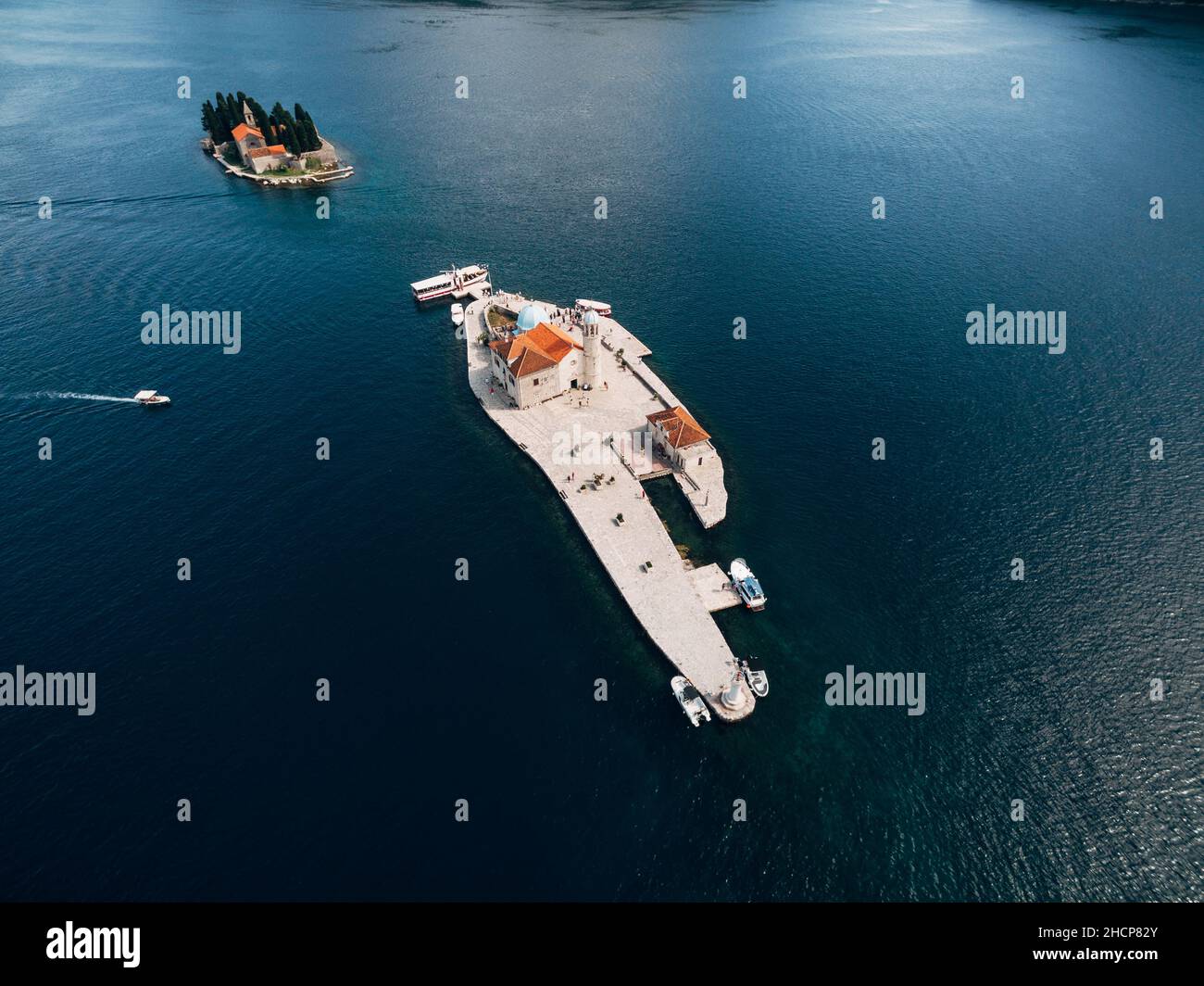 Island of Gospa od Skrpjela against the background of the island of St ...