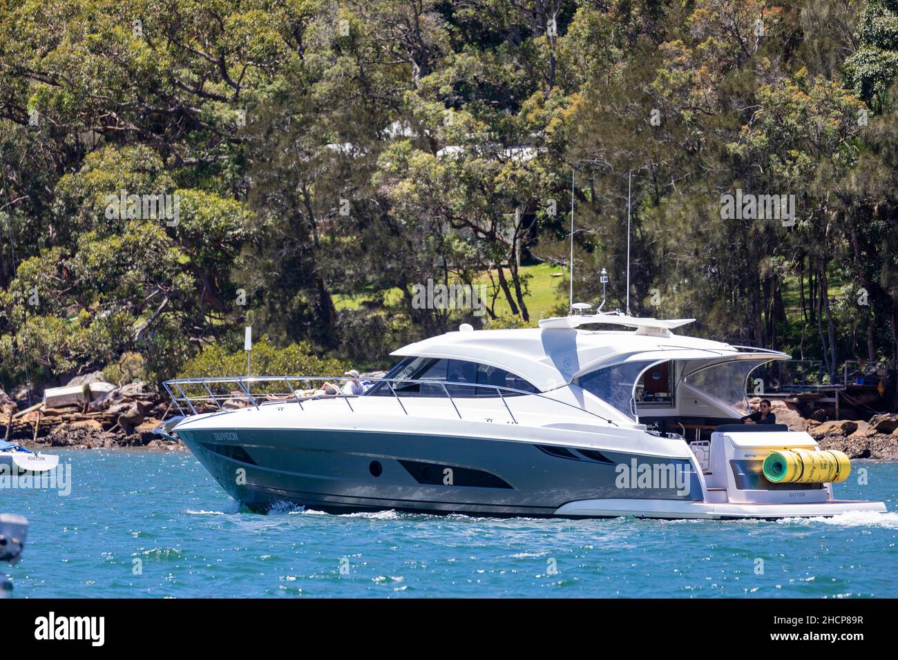 Luxury Riviera motor cruiser boat leaves the basin area coasters ...