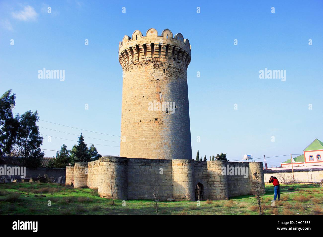 A photographer takes pictures of the fortress in Mardakan. Azerbaijan ...