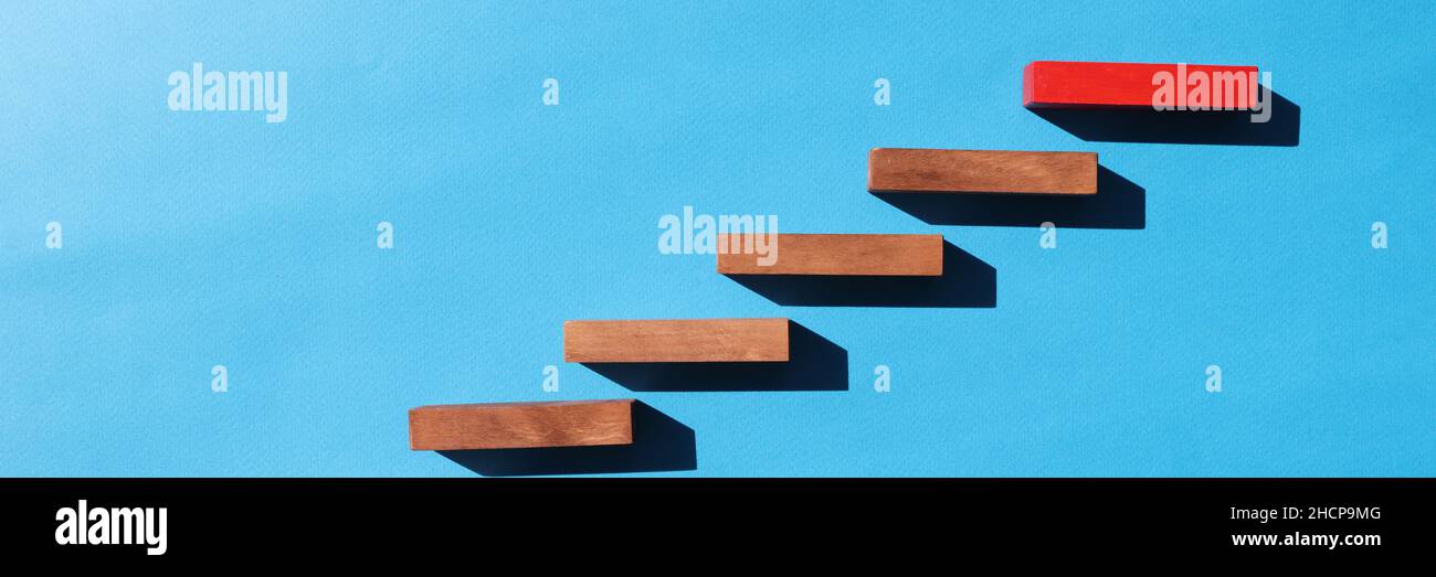 Wooden blocks in form of ladder upstairs red on dove background Stock ...