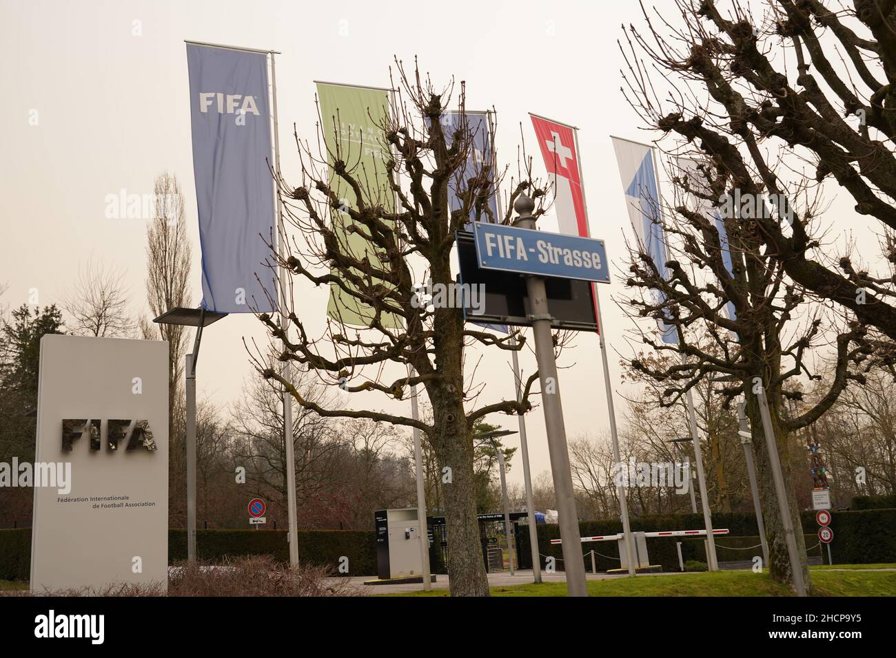 Entrance of the FIFA headquarters with flags and signpost of the ...