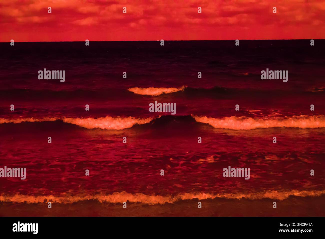 Winter sea, black choppy water, anxious sunset sky. The light of the ...