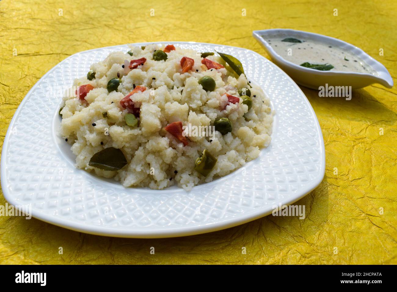 Rava Upma / Uppuma a south indian breakfast served in a bowl with ...